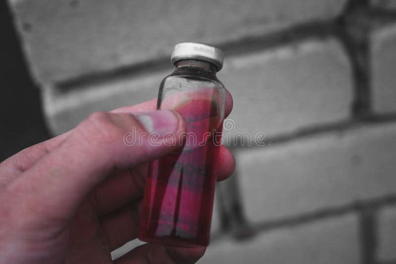 Erlenmeyer Flask with Red Solution Standing on a Stone Surface Stock ...