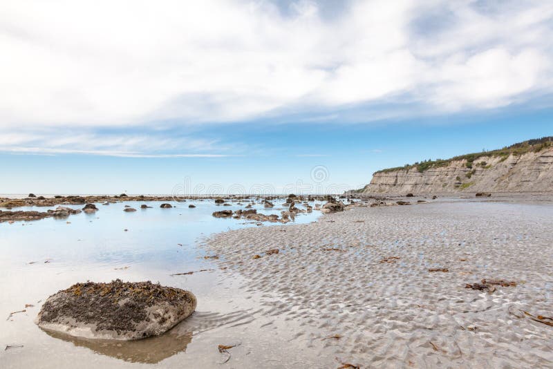 Eroded Tide Pool Rock Formation in California. Sunset Sky Reflection in ...