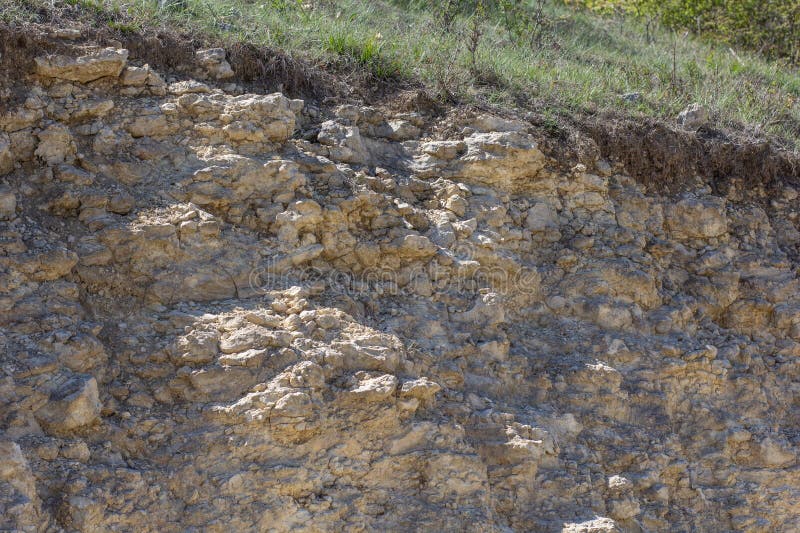Eroded Limestone Cliff with Grass Top Stock Photo - Image of layers ...