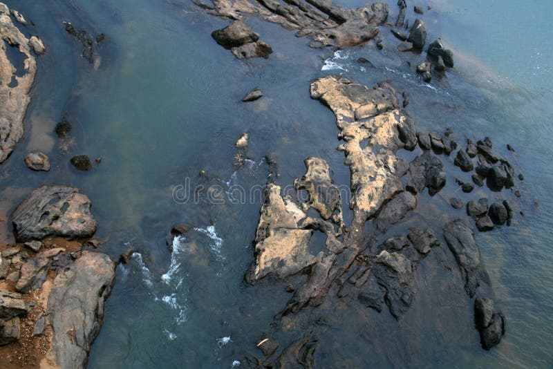 Eroded rock in a river bed stock image. Image of horizon - 55125275