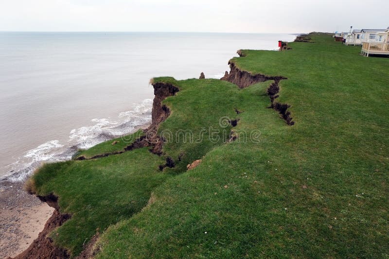 Eroding clay cliffs. stock photo. Image of coast, waves - 70332200