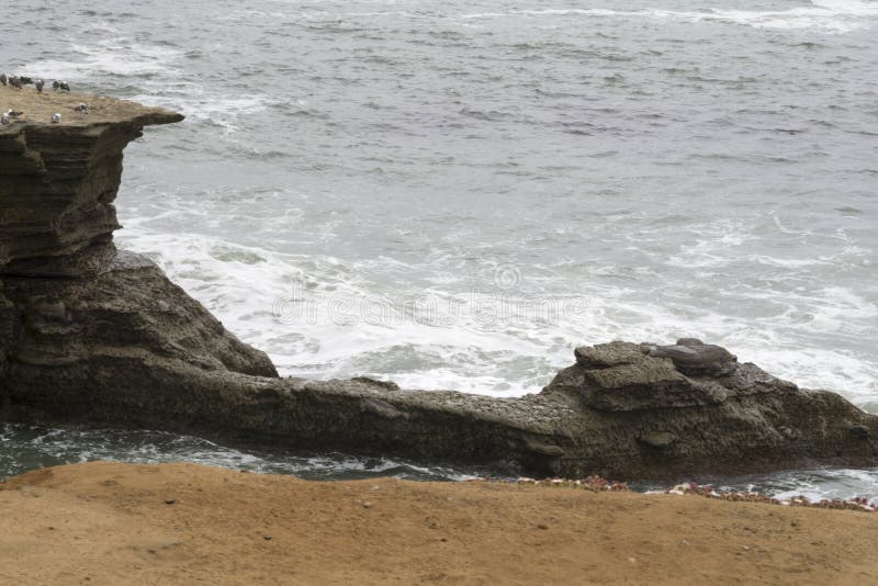 Erosion of Beach by Pacific Ocean Stock Image - Image of cloudy, sheer ...