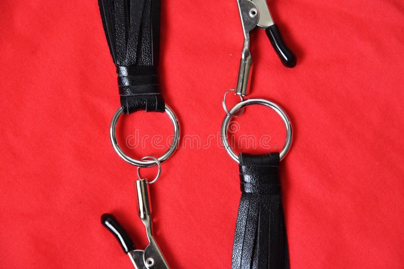 Nipple Clamps In Red Background Bdsm Outfit Accessories For Adult Sex