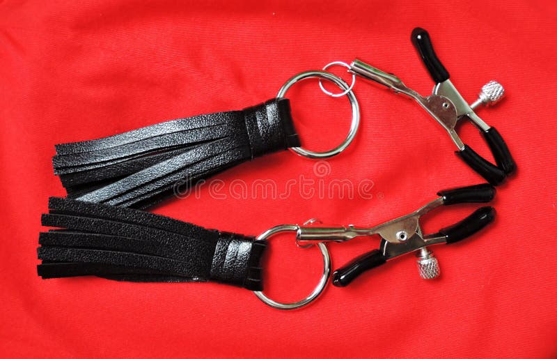 Nipple Clamps In Red Background Bdsm Outfit Accessories For Adult Sex