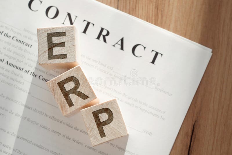 ERP Wooden Blocks on a Printed Contract Document Highlighting ...