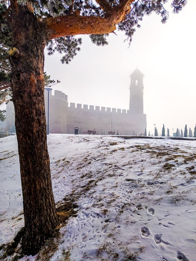 Erzurum Castle and Clock Tower Framed by a Tree in a Snowy, Dramatic ...