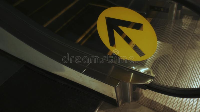 Escalator and arrow sign stock footage. Video of stairway - 191137972