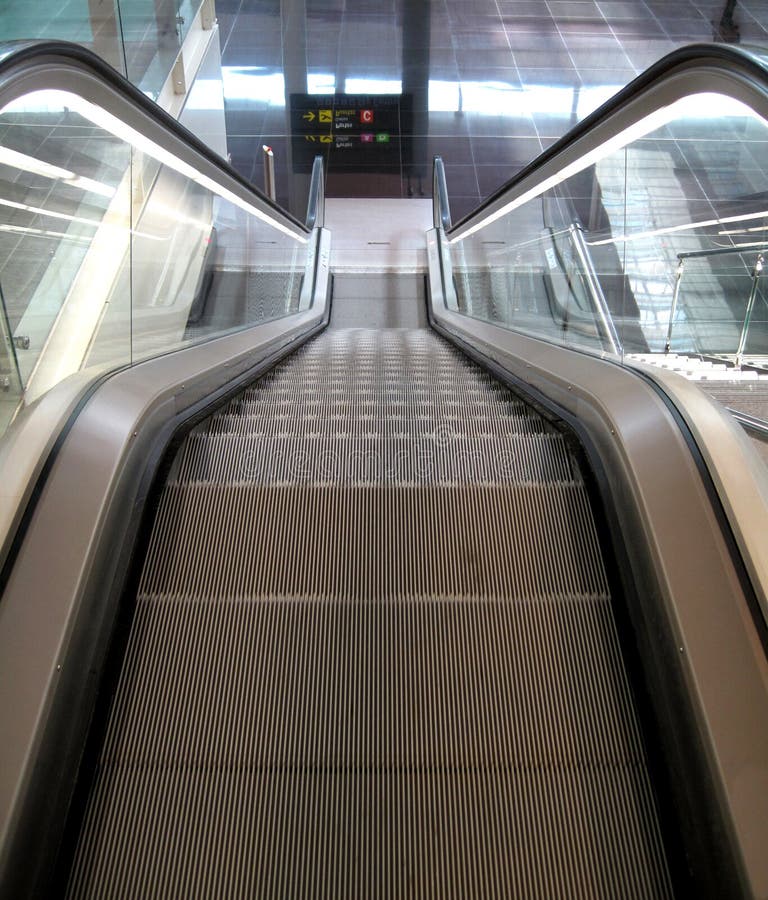 Escalator going down stock photo. Image of ladder, climb - 12733708