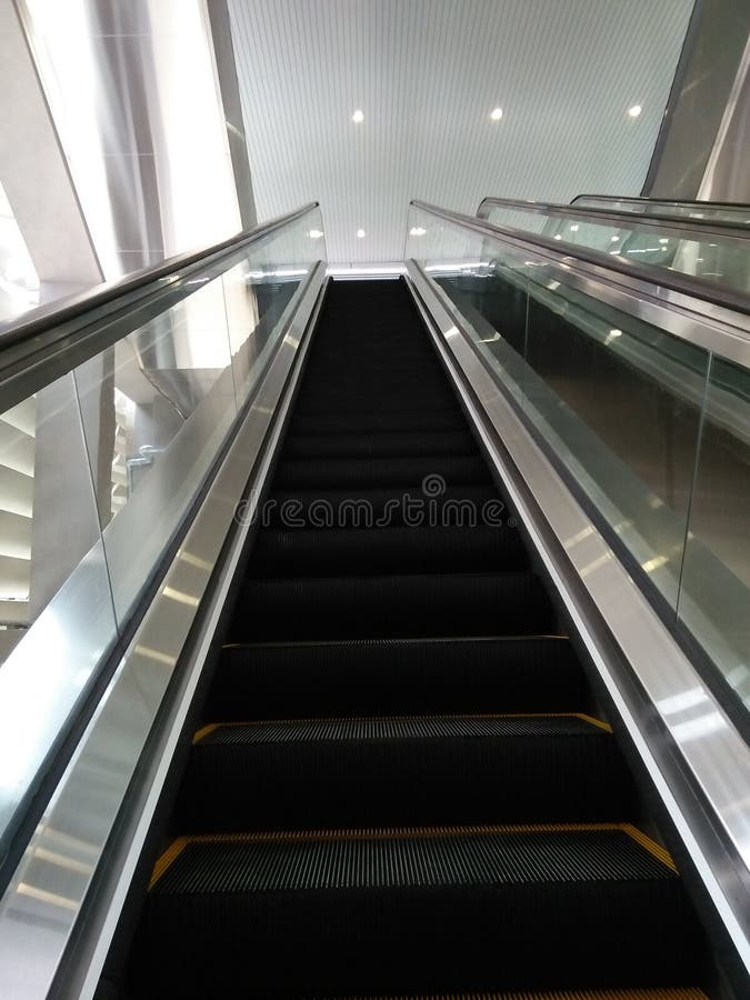 Escalator stock image. Image of light, steps, stainlesssteel - 86099155