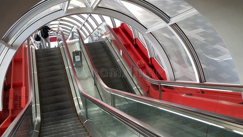 Escalator in the Red Tunnel Stock Photo - Image of speed, escalators ...