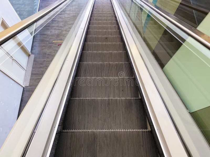 Escalator steps stock photo. Image of upper, people - 322851314