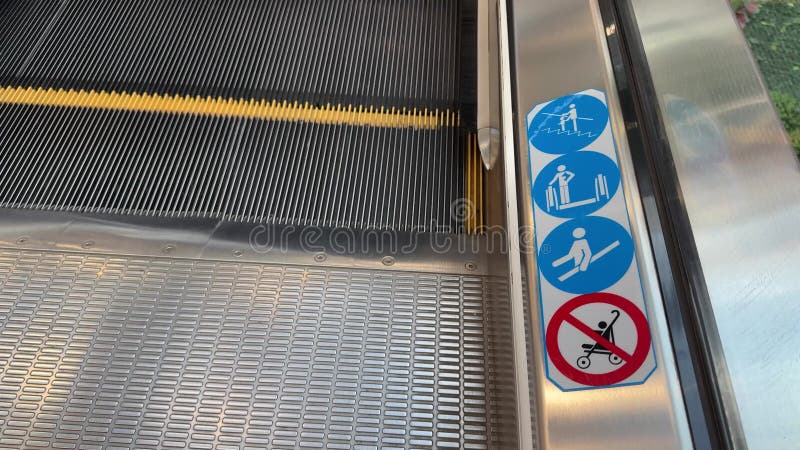Escalator with Usage Instructions for Pedestrians, Disabled Access, and ...