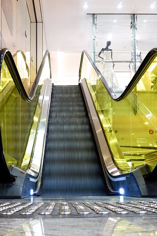 Yellow Escalator and Blue Roof Stock Image - Image of public, long ...