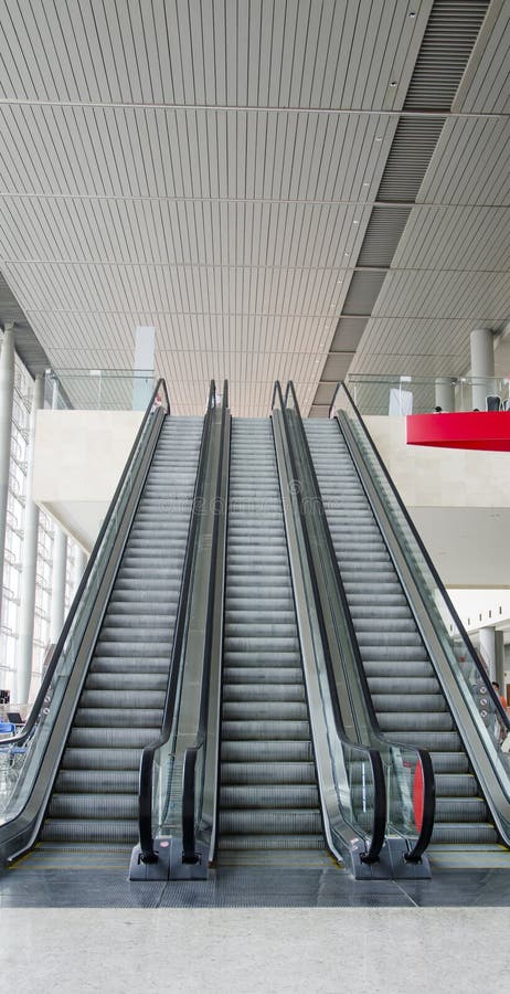 Escalators in the building stock photo. Image of mall - 71850100