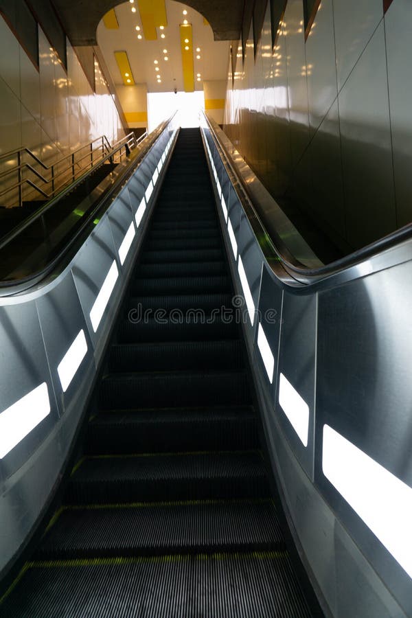 Escalators going up! editorial stock image. Image of street - 178712764