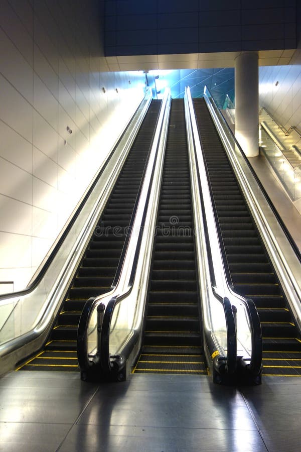 Three escalators stock image. Image of city, interior - 21382229