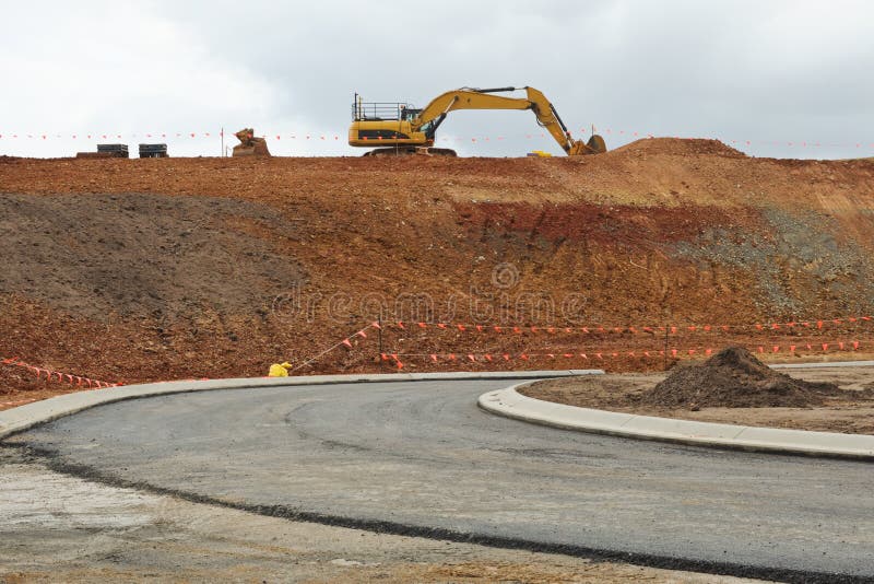 Escavatore in Terreno Rosso Immagine Stock - Immagine di roadwork ...