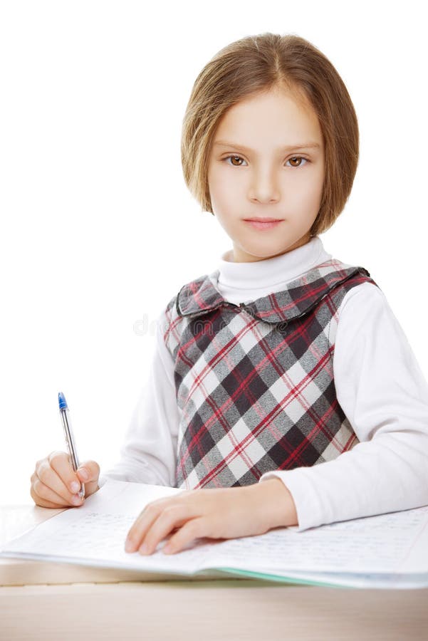 Escrita Da Menina Em Trabalhos De Casa Do Caderno Foto de Stock ...