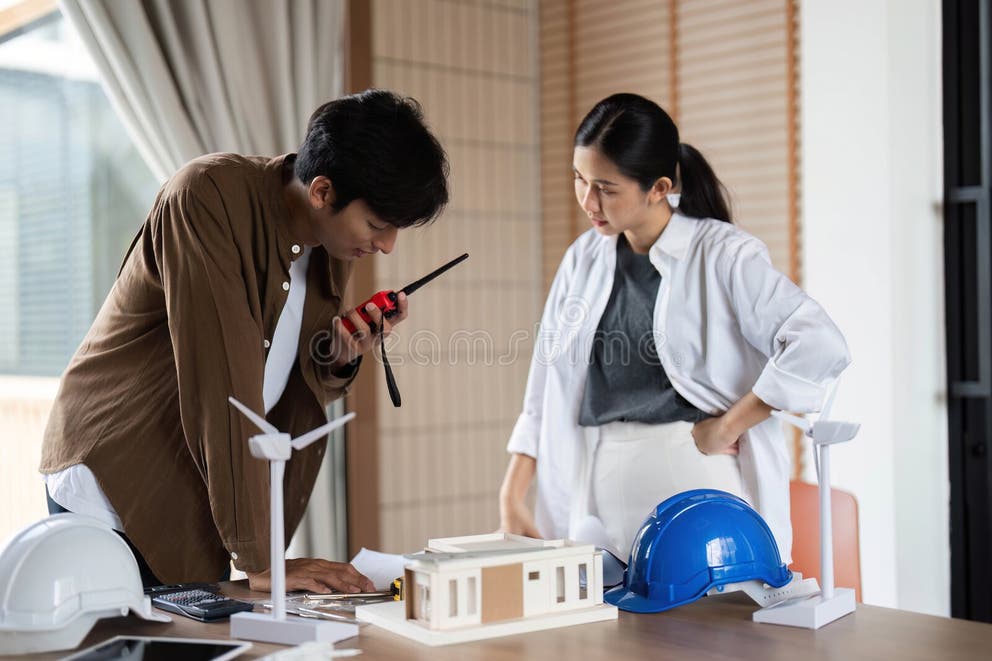 ESG Implementation. Architects Discussing Sustainable Design Using ...