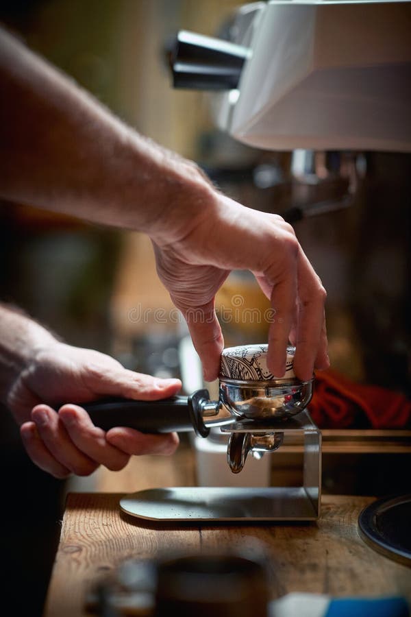 An Espresso Coffee is Being Prepared by a Barman Behind the Bar. Coffee ...