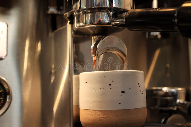 Espresso Coffee Extraction from a Professional Coffee Machine Stock ...