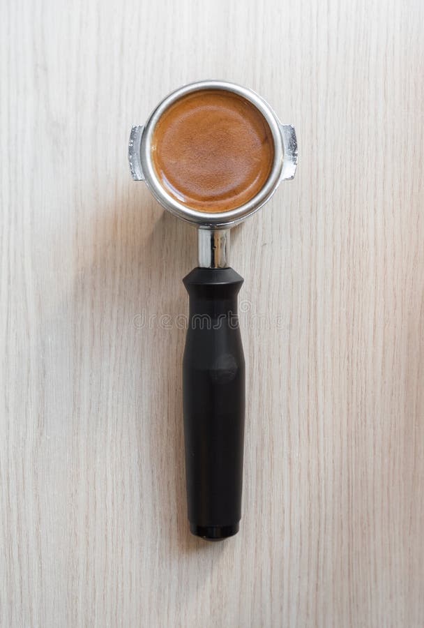 Espresso Coffee in a Handle Stock Photo - Image of wooden, aroma: 287888348