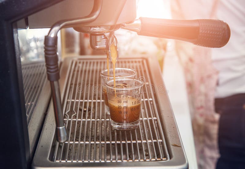 Espresso Coffee Machine with Filter Make Coffee Flowing into a C Stock ...