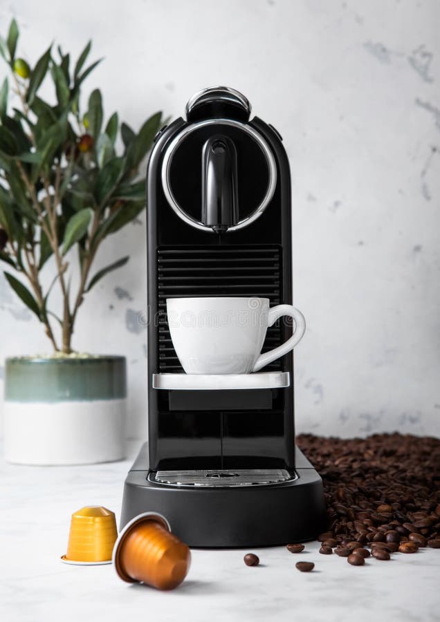 Espresso Coffee Machine with White Cup and Pods Capsules on Light ...