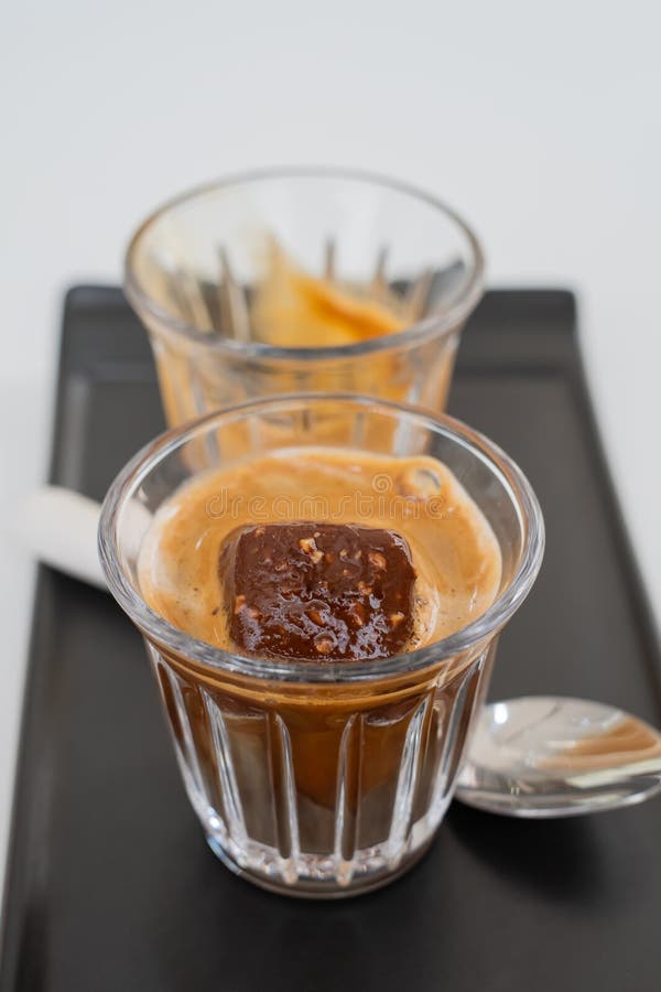 Iced Espresso with Chocolate Cube in Glass Cup Stock Photo - Image of ...