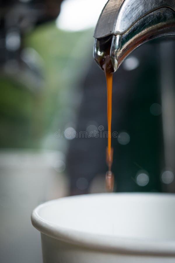 Espresso Coffee Stream Flowing from the Inside of Coffee Machine Stock ...
