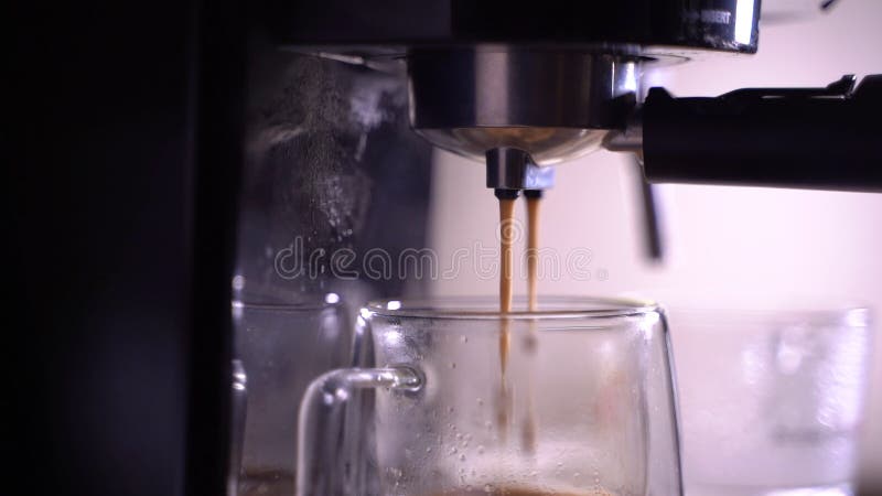Espresso Crema Comes Out of the Fully Automatic Coffee Machine Stock ...