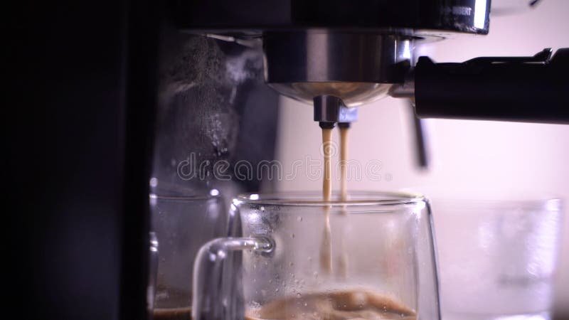 Espresso Crema Comes Out of the Fully Automatic Coffee Machine Stock ...