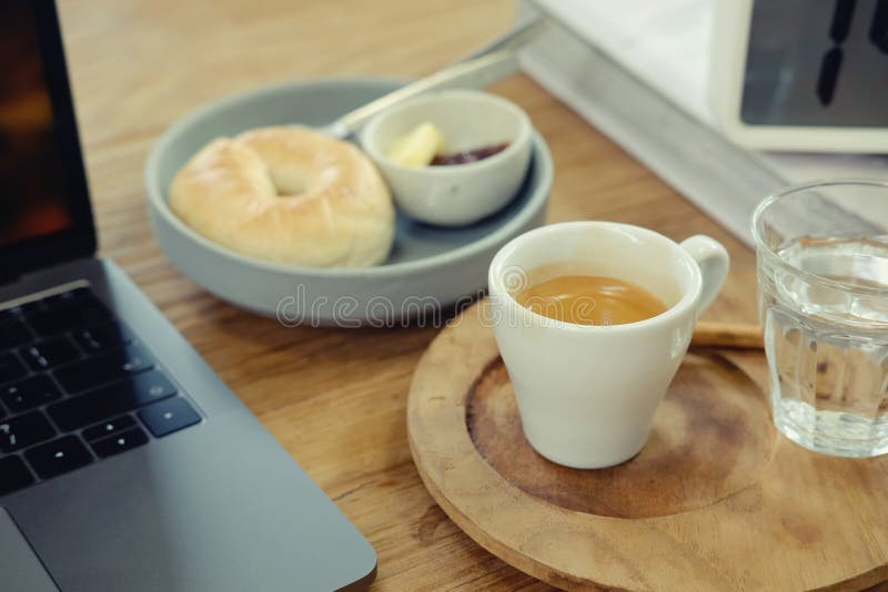 Espresso Cup of Coffee and Breakfast on Working Table. Stock Image ...