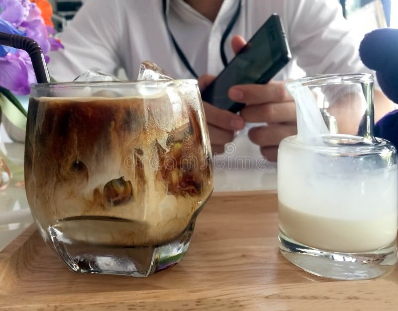Espresso Ice Coffee with Milk with Cell Phone Stock Photo - Image of ...
