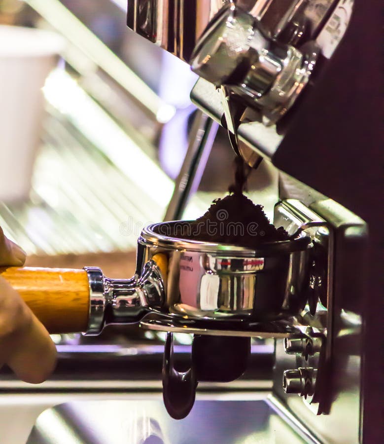 Espresso Machine Grinding Roasted Coffee Bean into Tamper Stock Photo ...