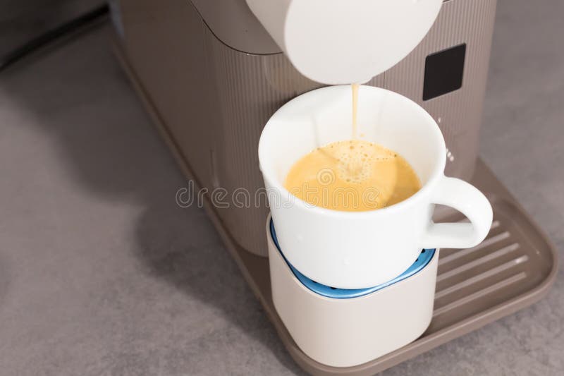 Espresso Machine Making Coffee on Table, Elevated View Stock Photo ...