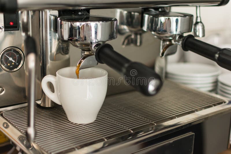 Espresso Pouring from Coffee Machine into One Cup Stock Image - Image ...