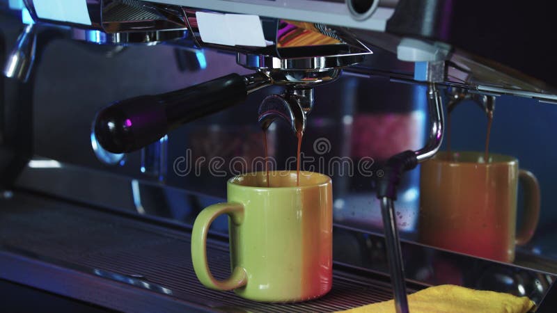 Espresso Pouring Out of the Coffee Machine in the Cup Stock Video ...