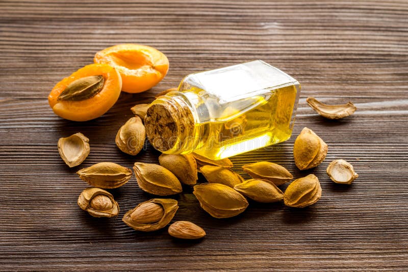Essential Apricot Kernel Oil with Dried Kernel Stock Photo - Image of ...