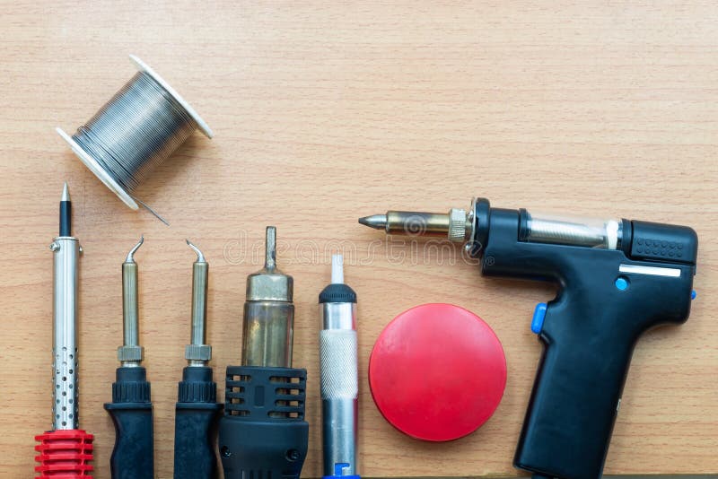 Essential Electronics Soldering and Desoldering Tools Arranged on a ...