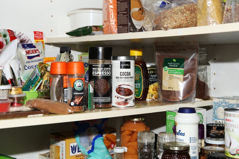 Essential Food Items Being Stored Inside a Pantry. Editorial Stock ...