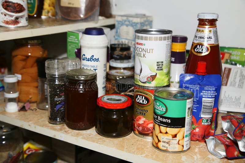 Essential Food Items Being Stored Inside a Pantry. Editorial Stock ...