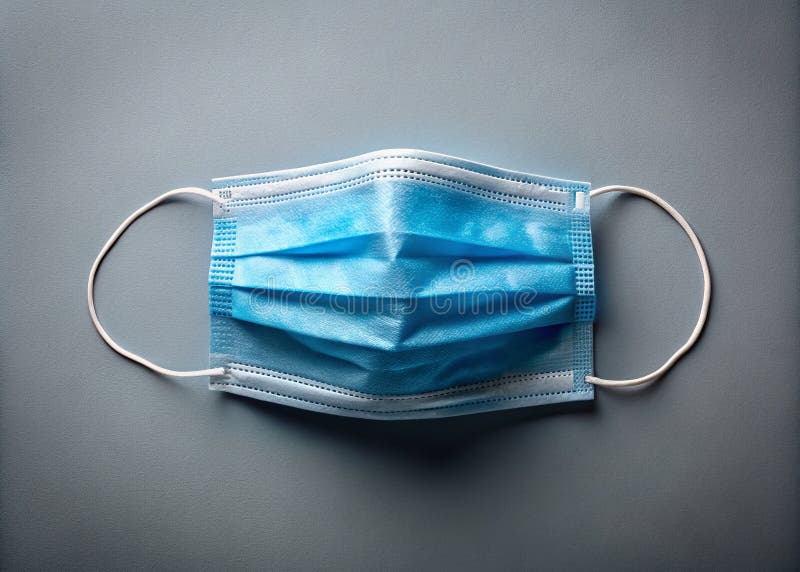 Essential Light Blue Surgical Face Mask on a Neutral Grey Background a ...