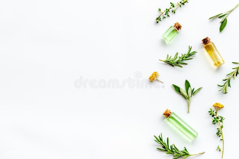 Essential Oils and Fresh Herbs on White Background Top View Pattern ...