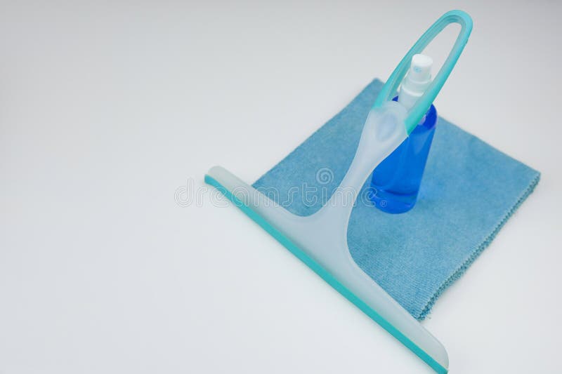 Essential Tools for Window Cleaning a Squeegee, a Spray Bottle, and a ...