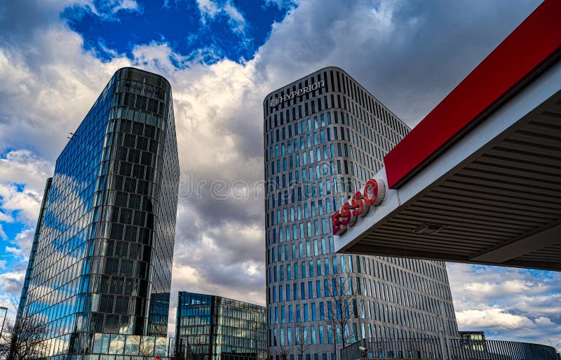 Esso Fuel Station in Front of a Hotel and Office Building Editorial ...