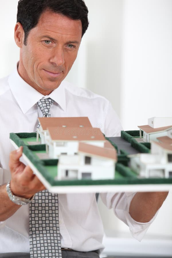 Estate Agent with Young Couple Stock Image - Image of estate, homeowner ...