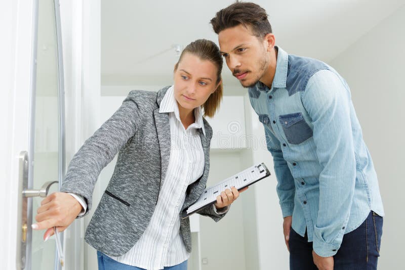 Estate Agent Pointing at Door Keyhole Stock Photo - Image of opening ...