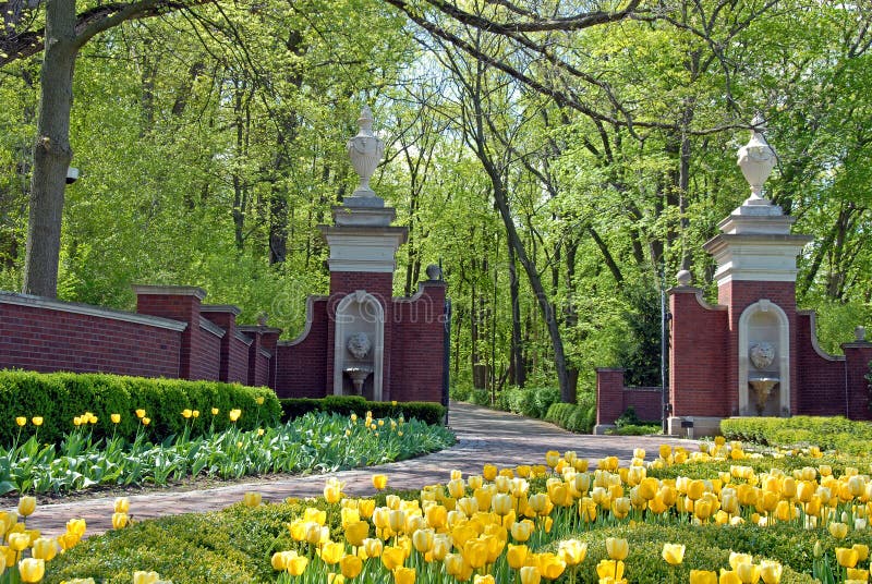 The Estate Gate with Spring Flowers Stock Photo - Image of model, large ...