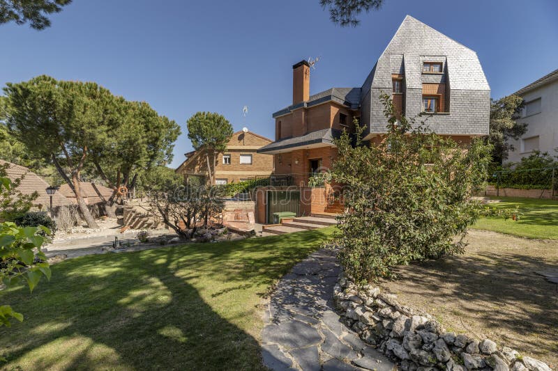Estate with Slate Tile Paths and Chalet with Characteristic Roof of the ...